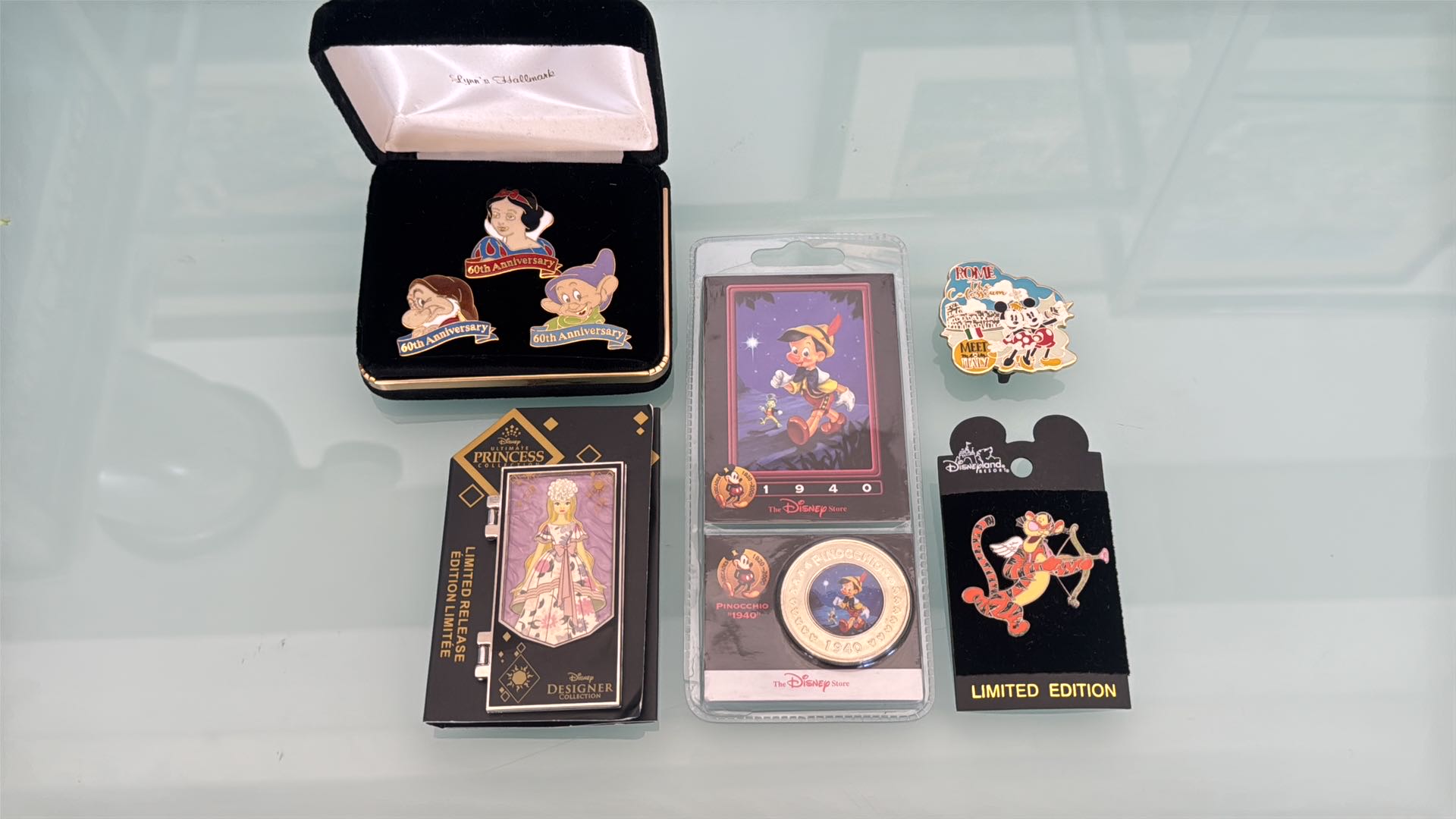 Disney enamel pins and Pinocchio coin lot | Maxsold